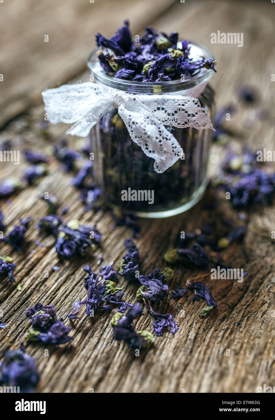 Glass jar and sweet violets on wood Stock Photo - Alamy