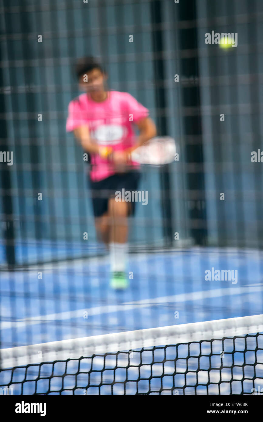 Paddle tennis player in action Stock Photo - Alamy
