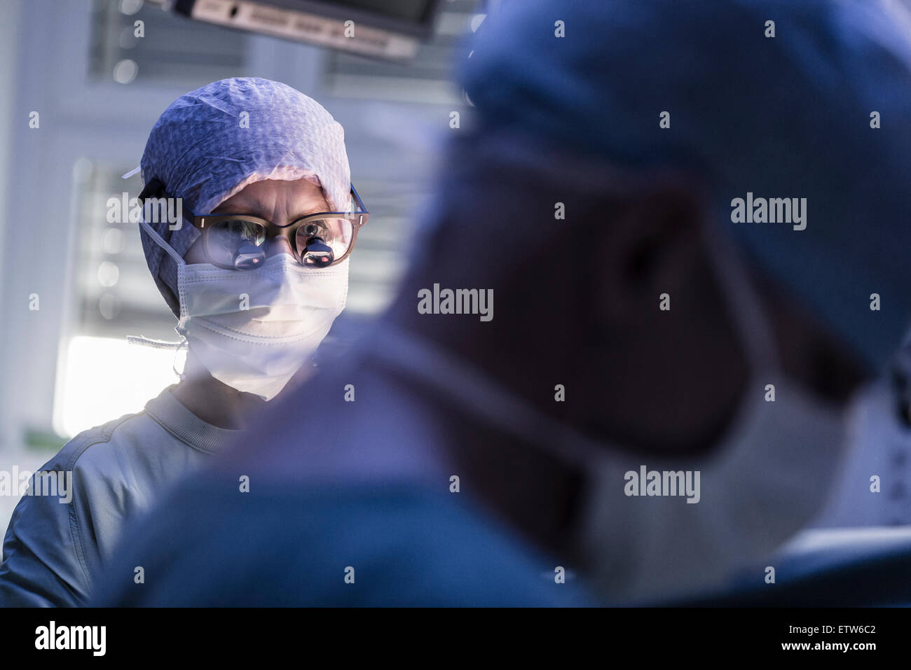 Two surgeons in operating room Stock Photo - Alamy