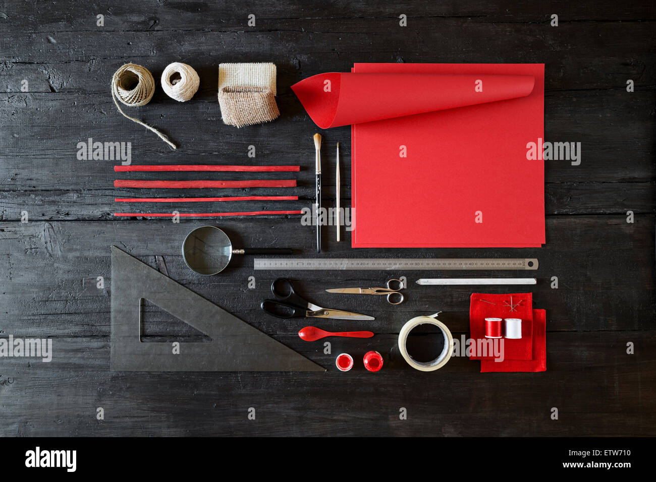 Arrangement of craft materials on black wood Stock Photo - Alamy