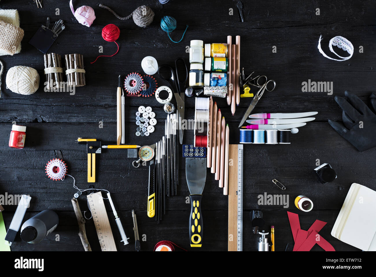 Arrangement of craft materials and tools on black wood Stock Photo - Alamy