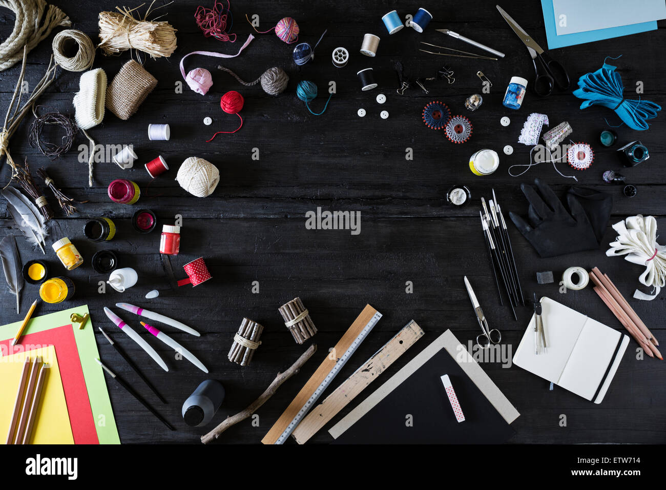 Arrangement of craft materials and tools on black wood Stock Photo - Alamy
