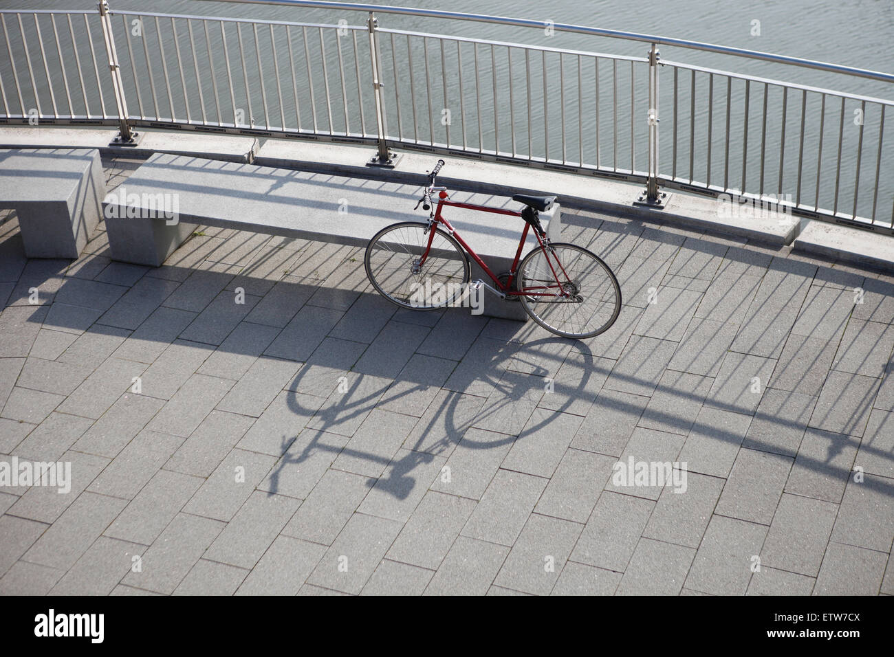 Germany, Duesseldorf, bicycle leaning at bench Stock Photo - Alamy
