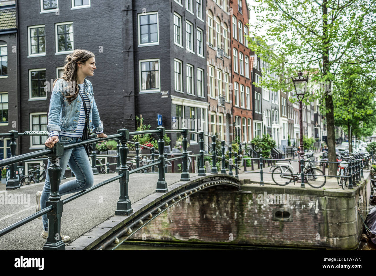 Woman standing on amsterdam hi-res stock photography and images - Alamy