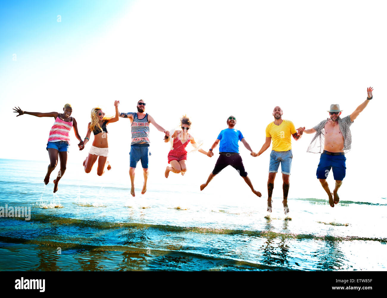Diverse Beach Summer Friends Fun Jump Shot Concept Stock Photo - Alamy