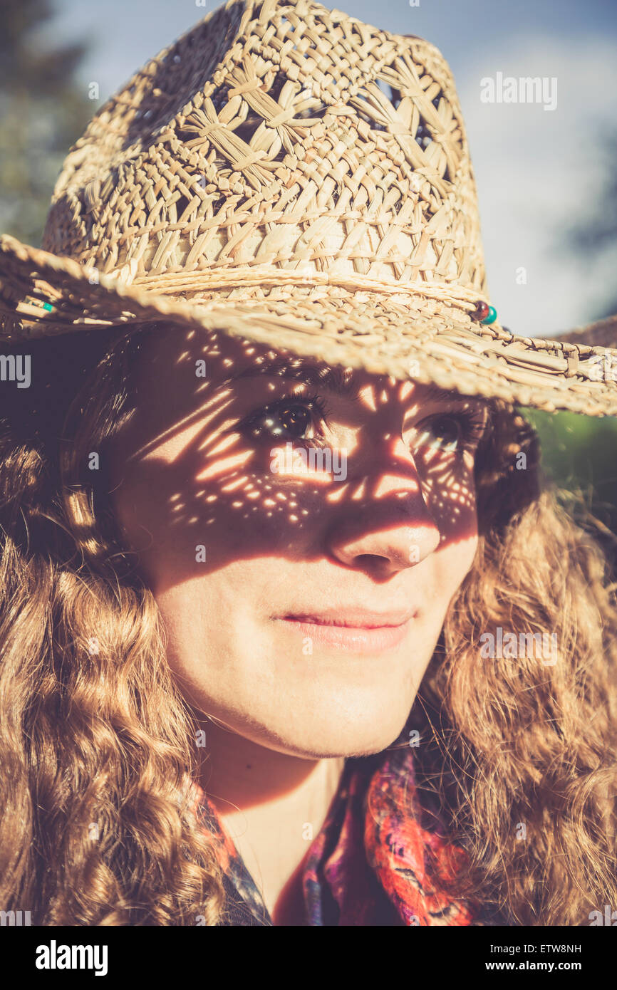 Young woman wearing straw hat Stock Photo - Alamy
