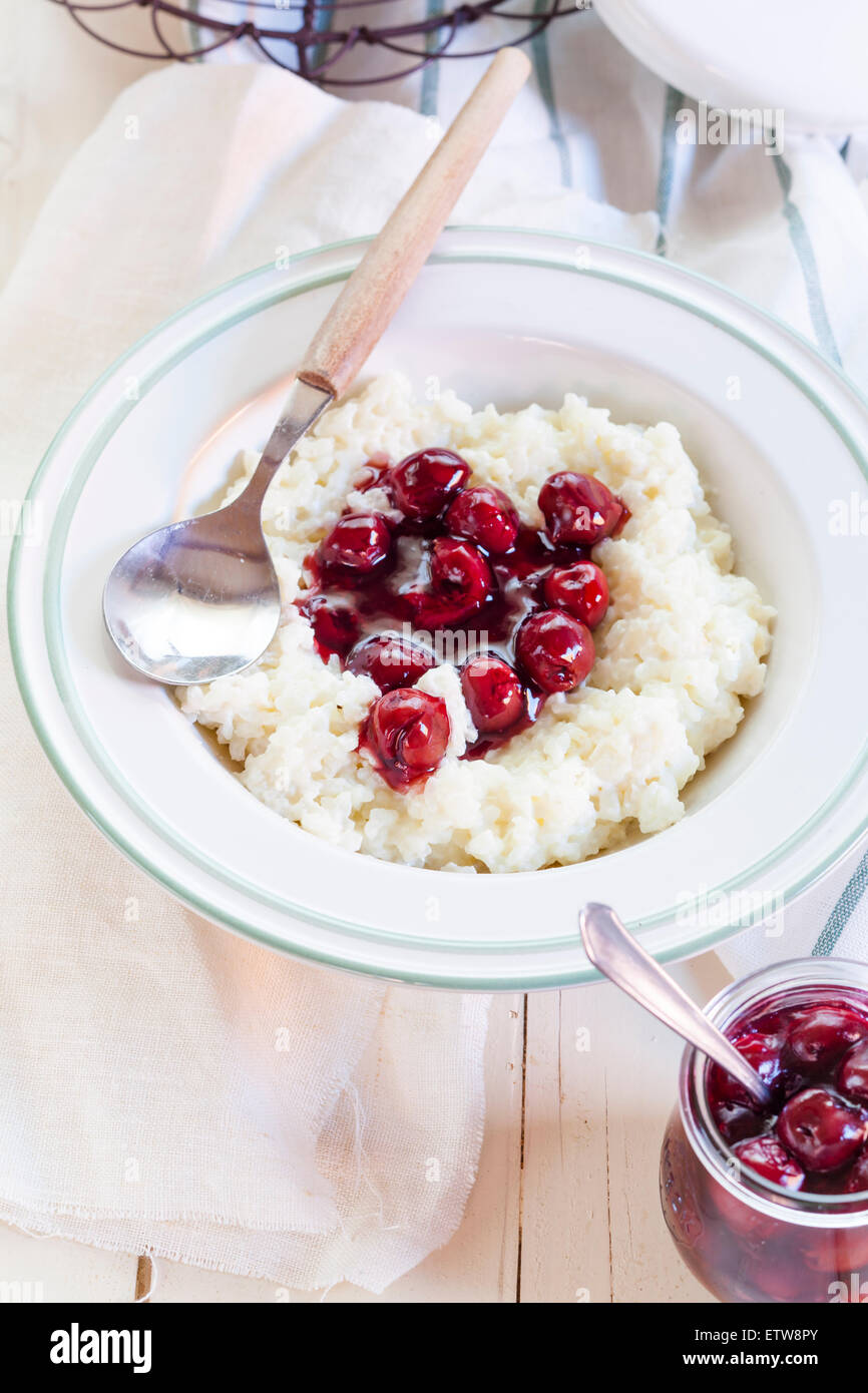 Rice pudding with cherry sauce Stock Photo - Alamy