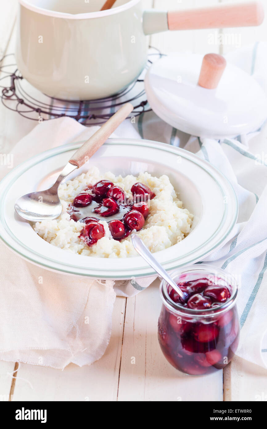 Rice pudding with cherry sauce Stock Photo - Alamy