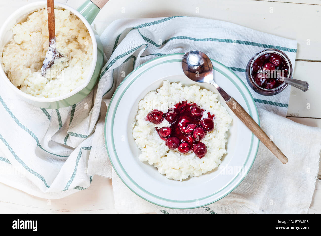 Rice pudding with cherry sauce Stock Photo - Alamy