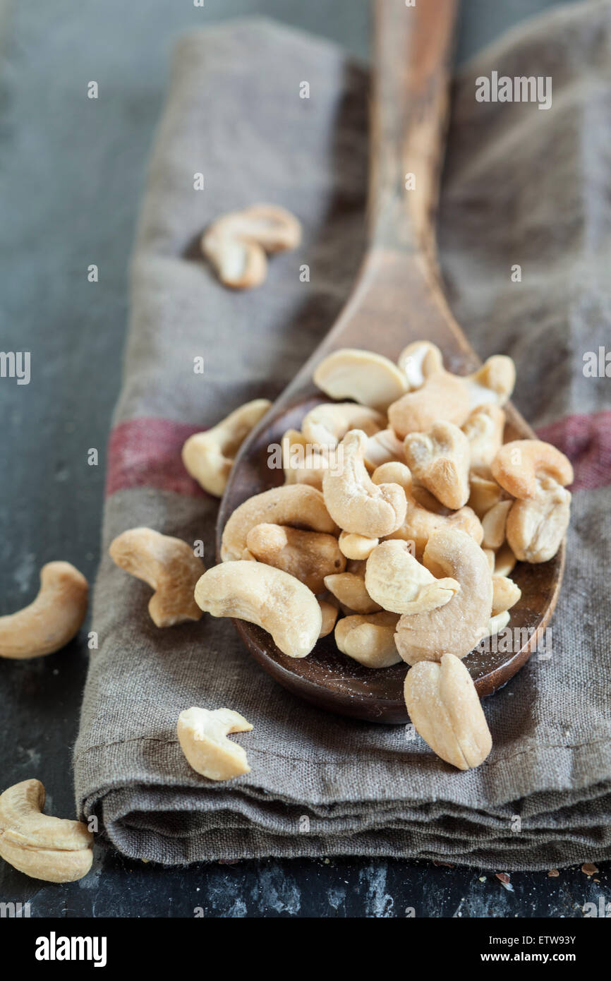 Wooden spoon of cashew nuts Stock Photo - Alamy