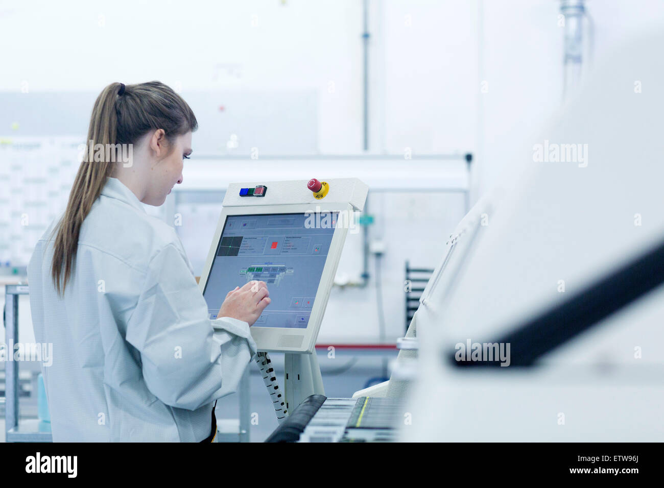 Technician working on monitor Stock Photo - Alamy