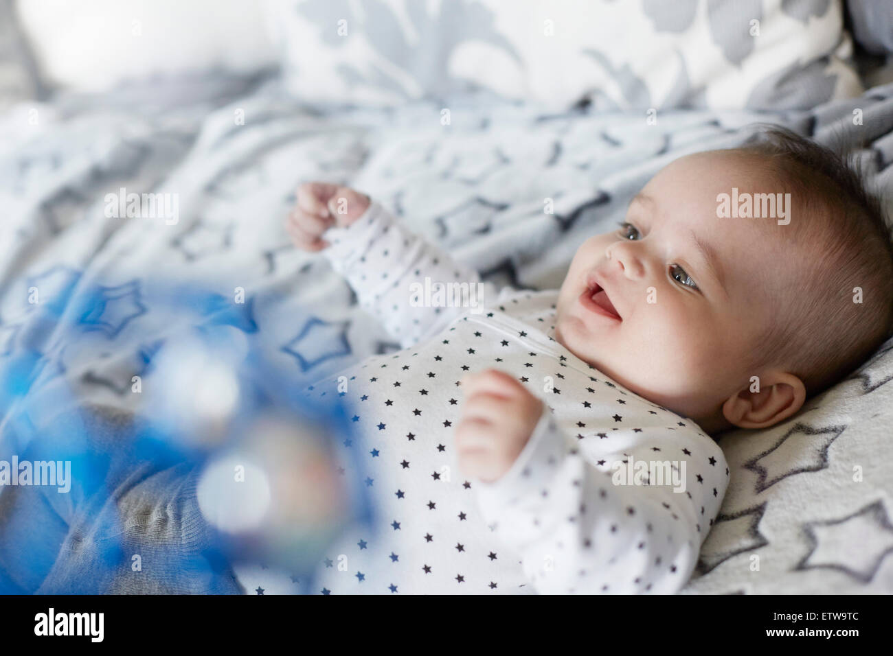 Baby lying down Stock Photo - Alamy
