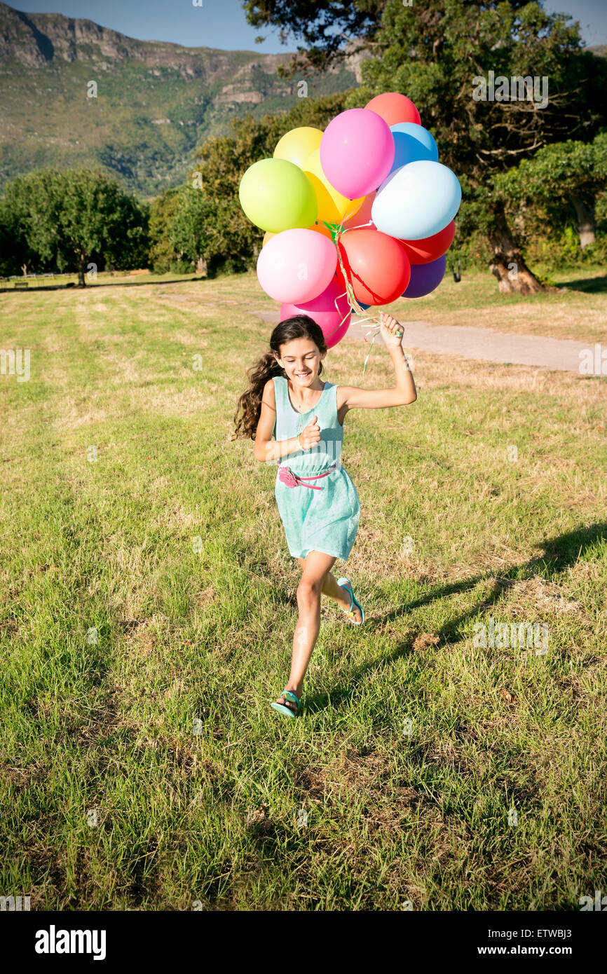 Happy child balloons on nature hi-res stock photography and images - Alamy