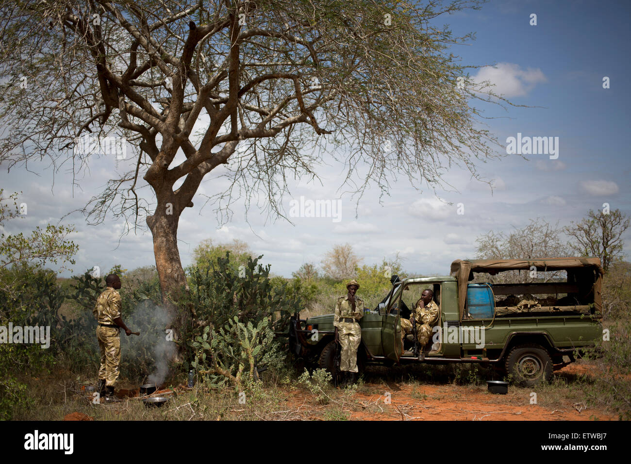 Kenya Wildlife Rangers from the anti poaching unit prepare lunch during ...