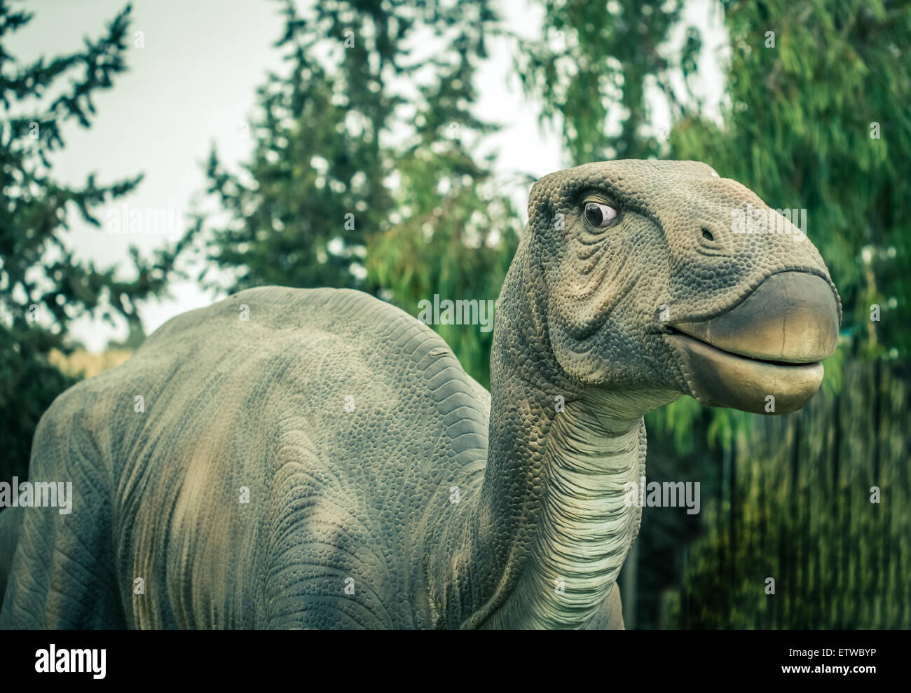 ancient extinct dinosaur on a background of plants Stock Photo - Alamy
