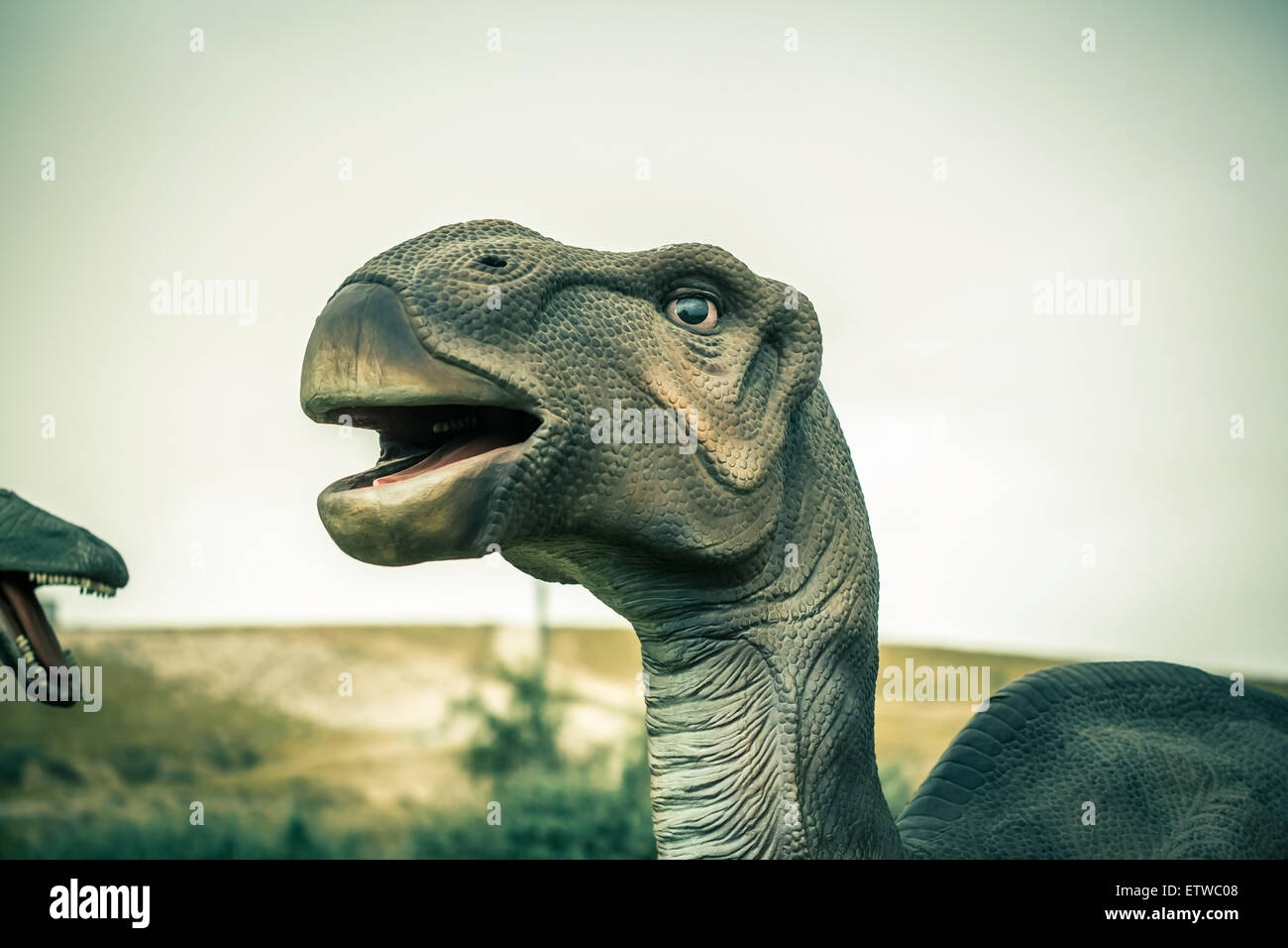 ancient extinct dinosaur on a background of plants Stock Photo - Alamy