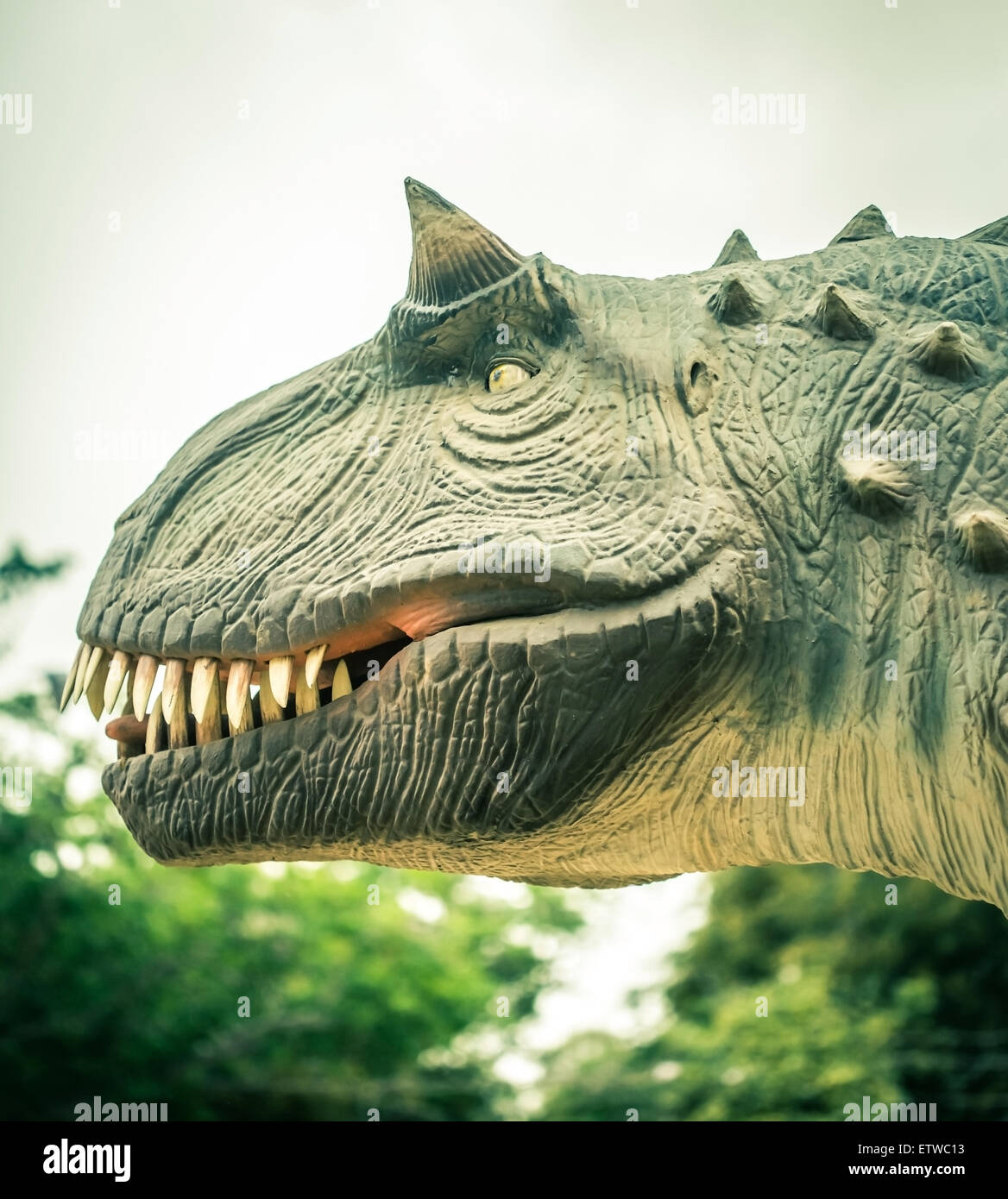ancient extinct dinosaur on a background of plants Stock Photo - Alamy