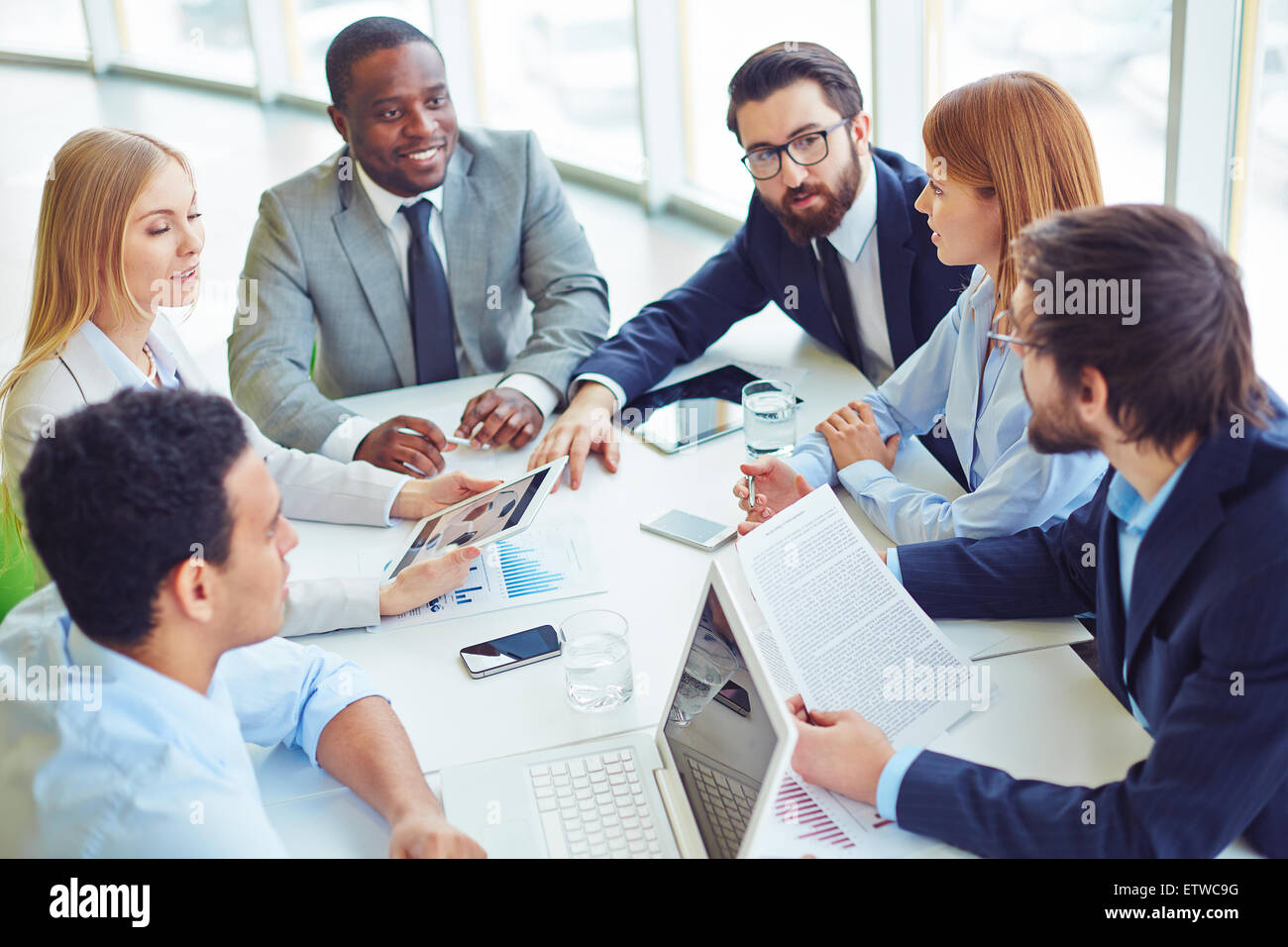 Group of successful professionals planning new project Stock Photo - Alamy