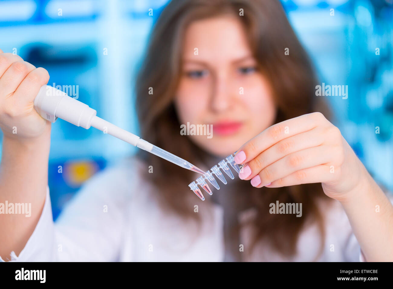 Girl with a pipette in a lab University Hospital Stock Photo - Alamy