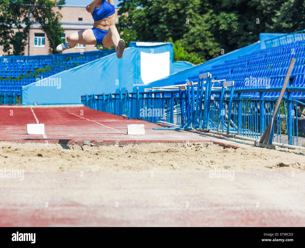 athletics competitions in long jump at the finish Stock Photo - Alamy