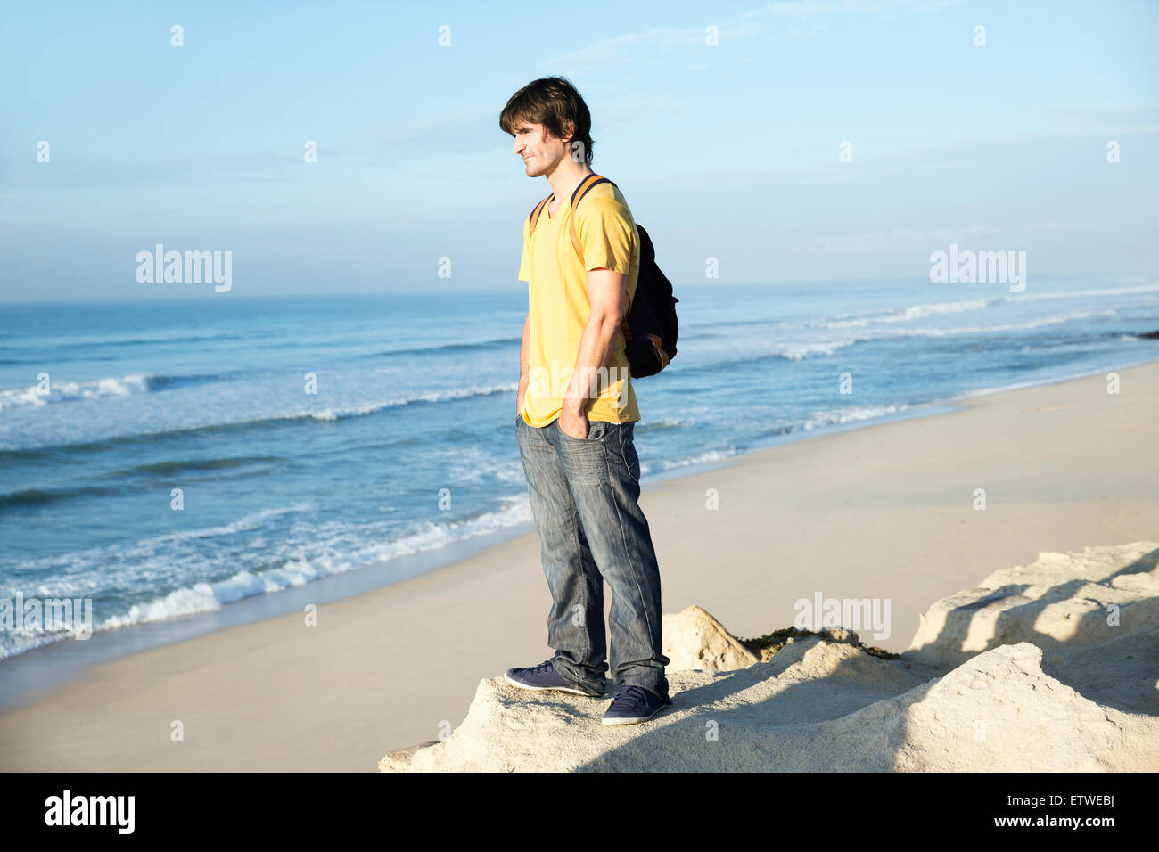 South Africa, man standing at the coast looking on the ocean Stock ...