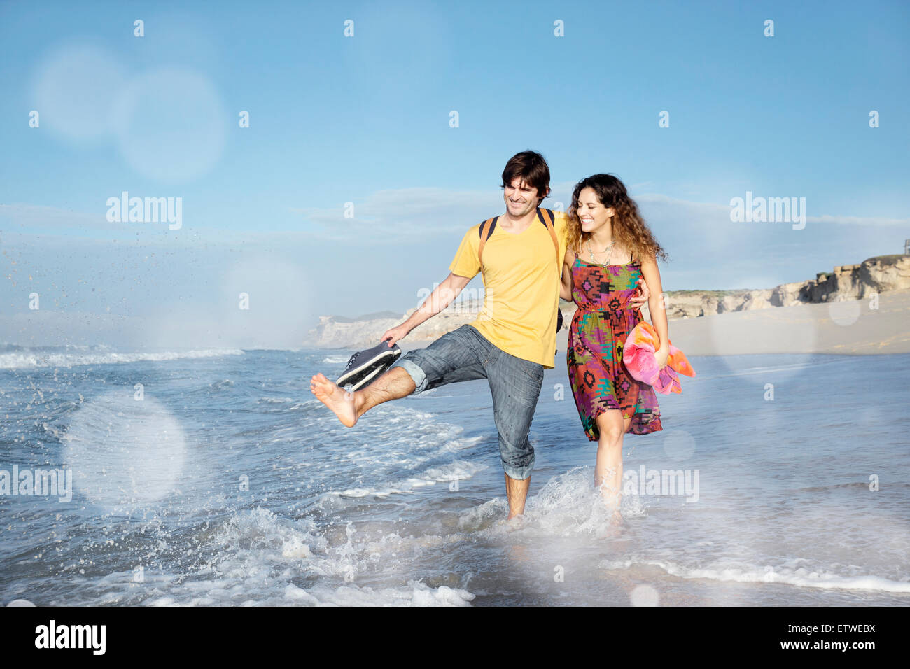 South Africa, happy couple wading in the ocean Stock Photo - Alamy