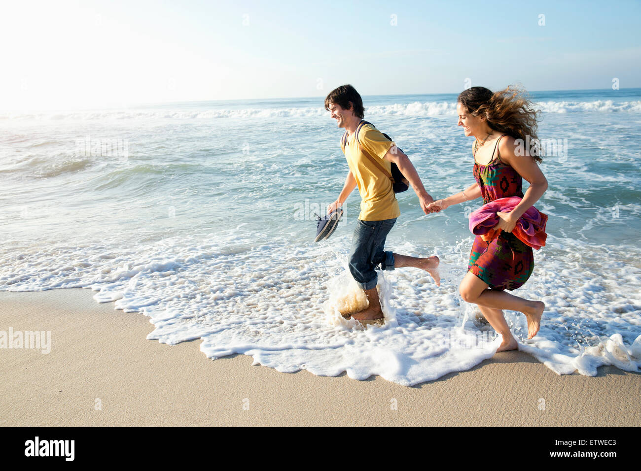 Woman strolling in surf hi-res stock photography and images - Alamy
