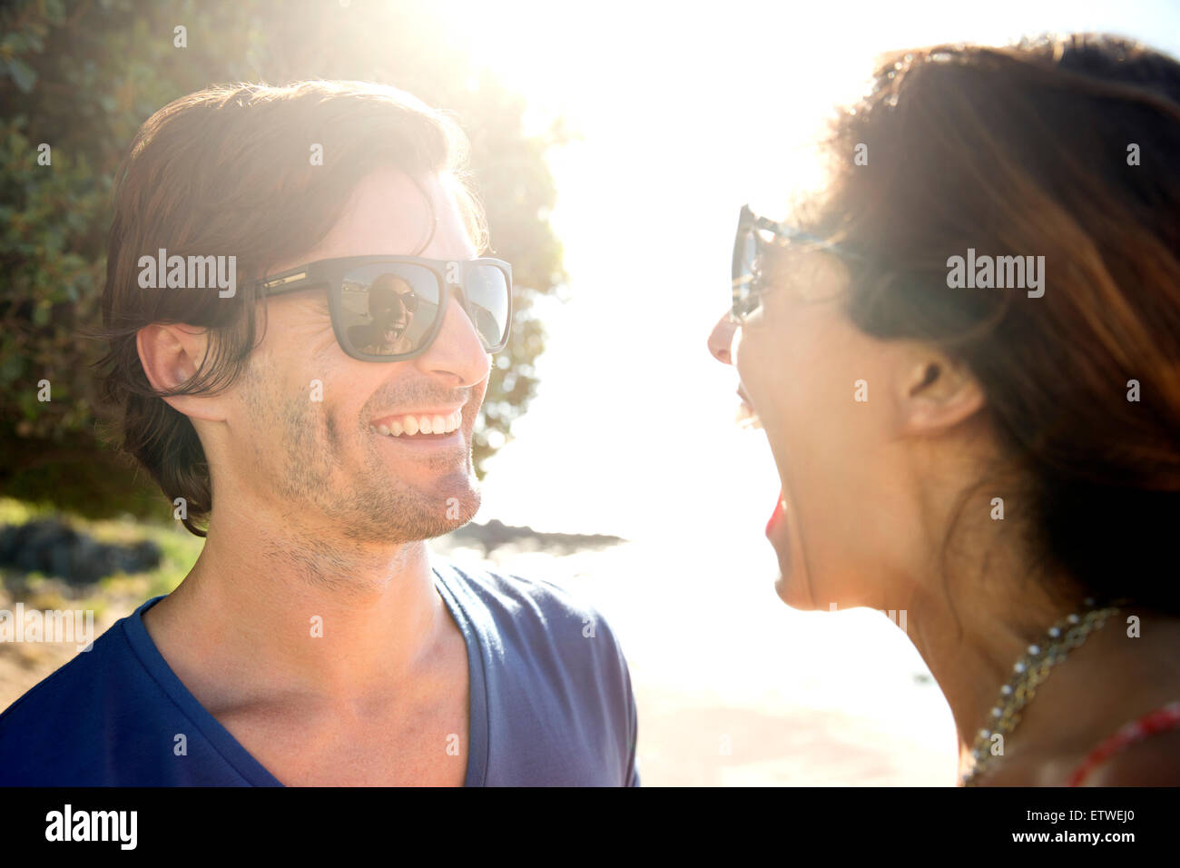 South Africa, woman laughing at smiling boyfriend Stock Photo - Alamy