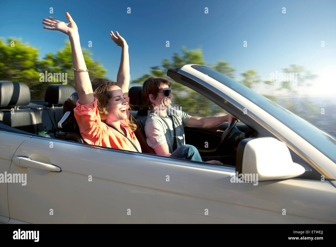 South Africa, happy couple in convertible Stock Photo - Alamy