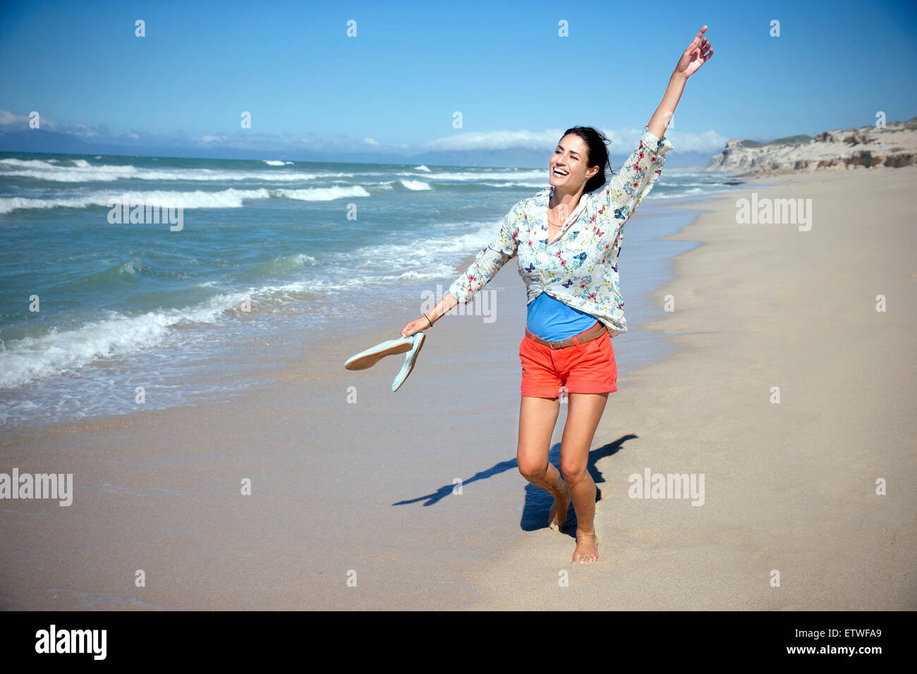 South Africa, happy woman dancing on the beach Stock Photo - Alamy