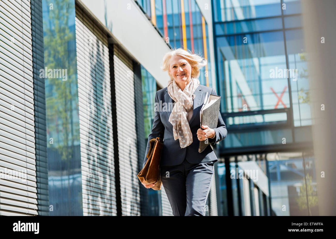 Carrying briefcase hi-res stock photography and images - Alamy