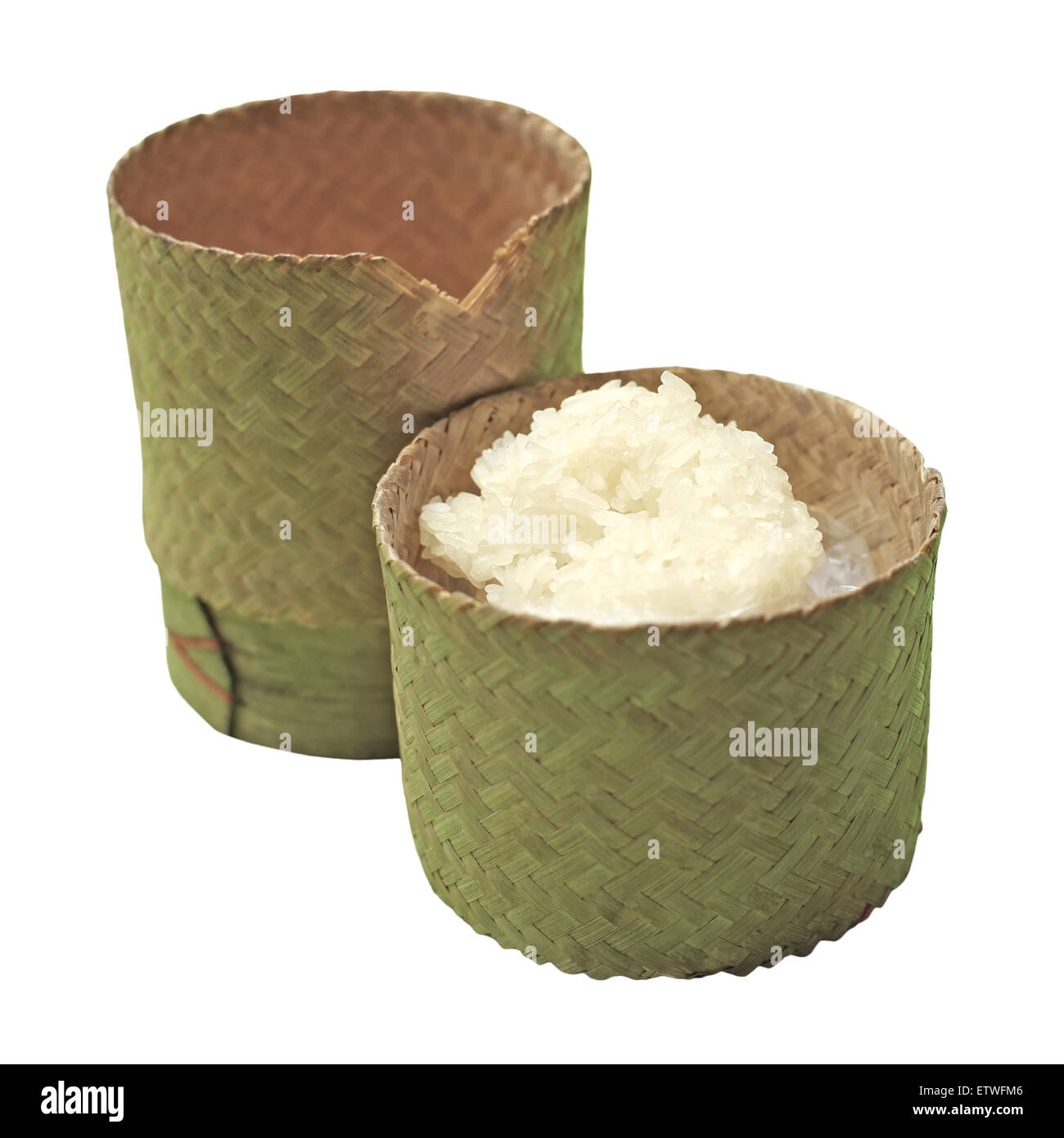 thai sticky rice in a bamboo wooden box isolated on white background ...