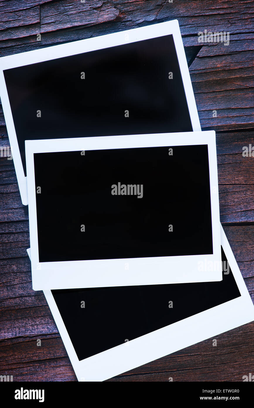 Blank instant photo frames on old wooden background Stock Photo - Alamy