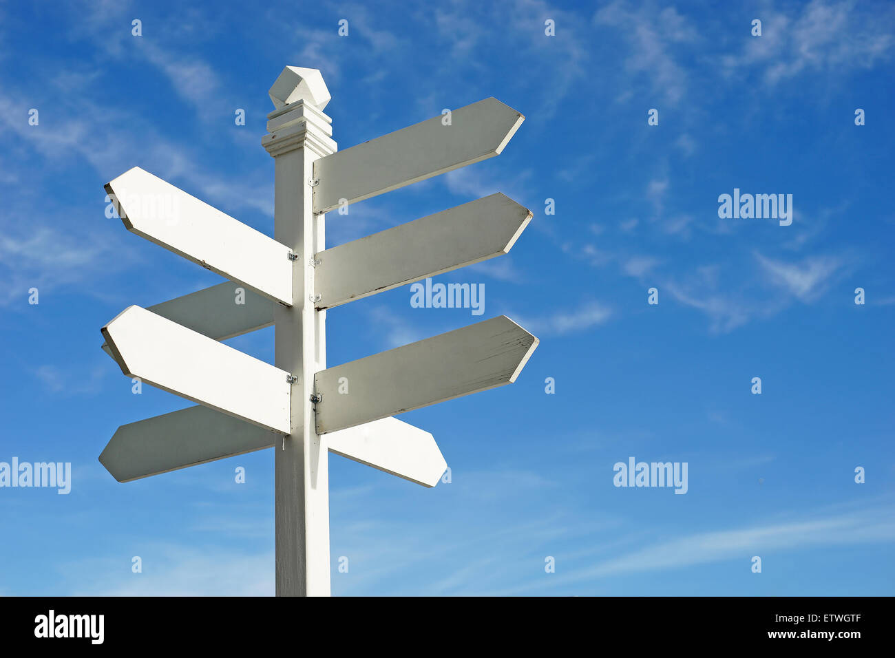 direction sign with blank spaces for text on beautiful sky background ...