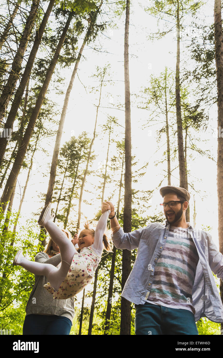 Happy family in forest Stock Photo - Alamy