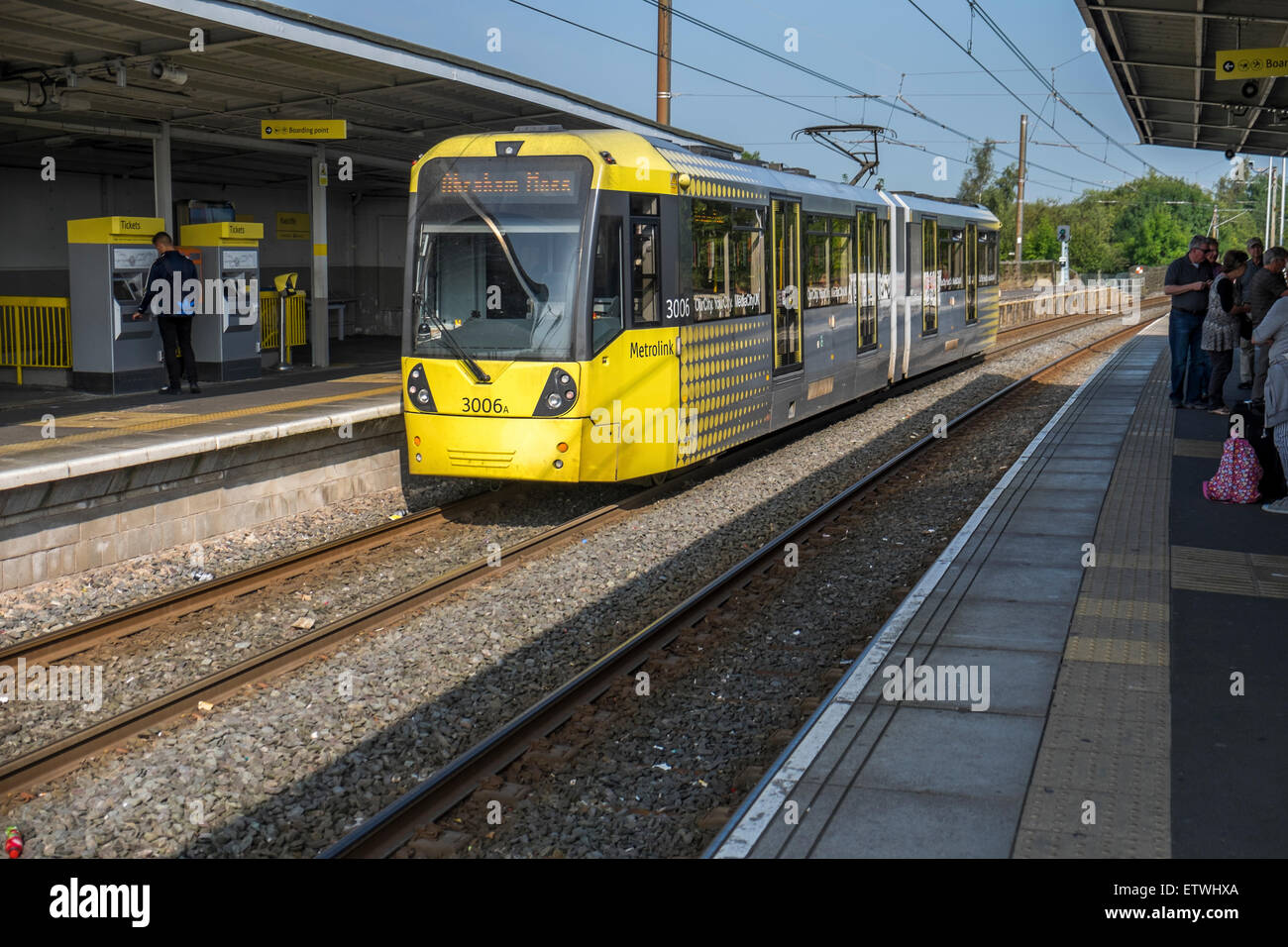 Modern electric tram system running through the streets of Manchester ...