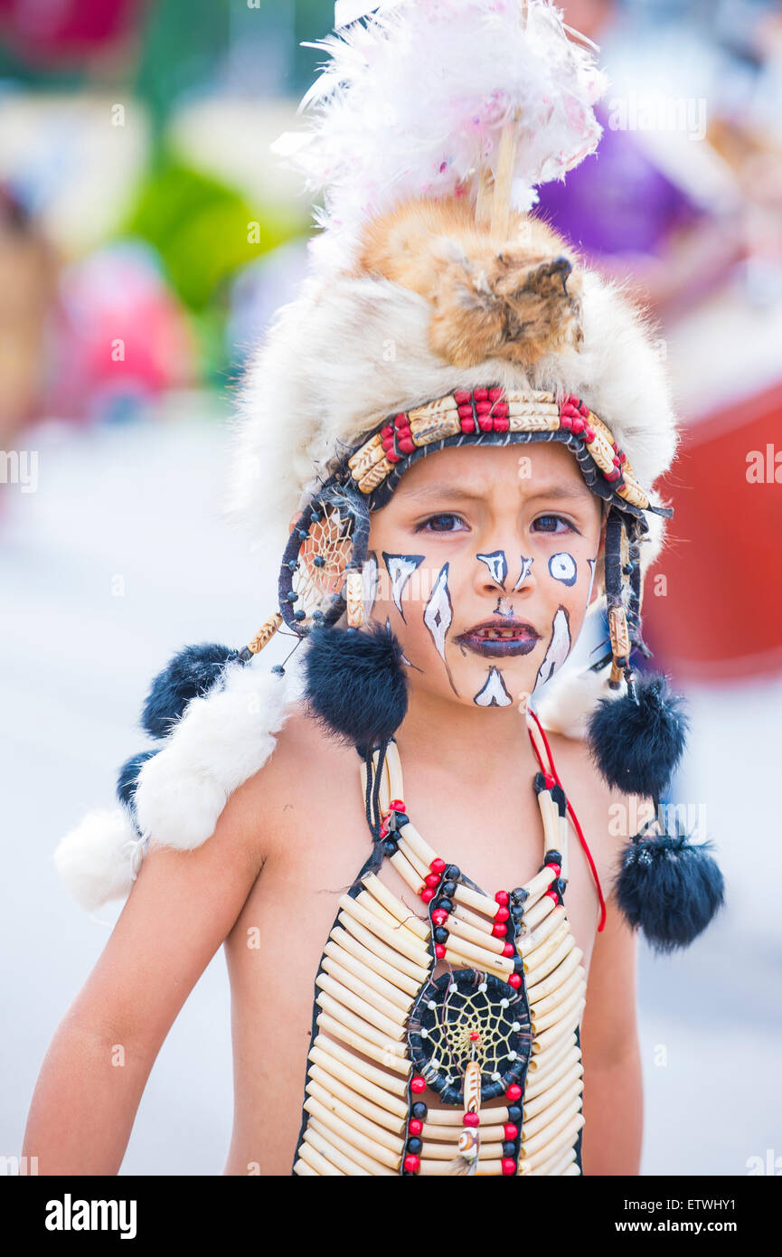 Native American boy with traditional costume participates at the ...