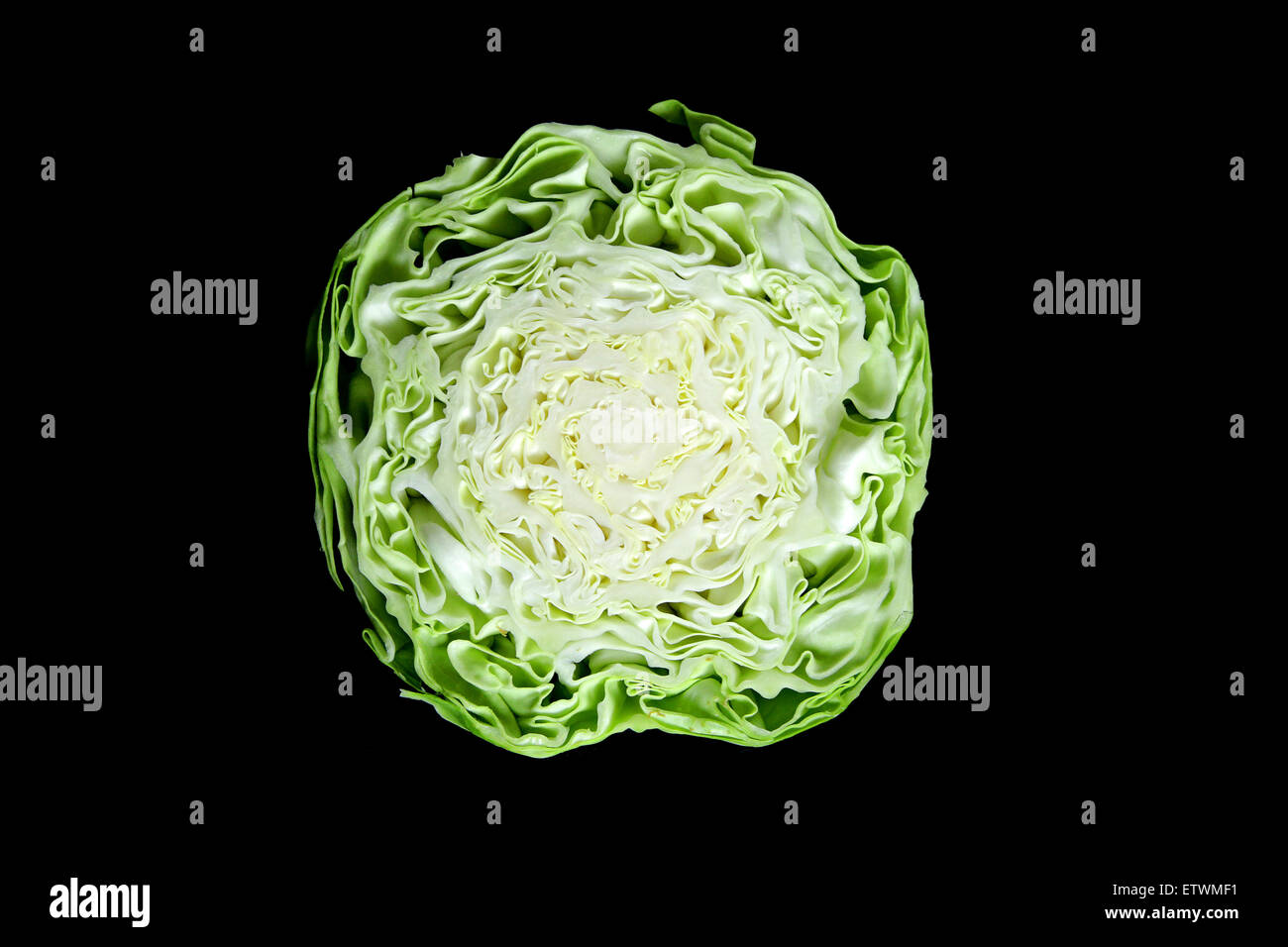 fresh green cabbage half isolated on black bacground Stock Photo - Alamy