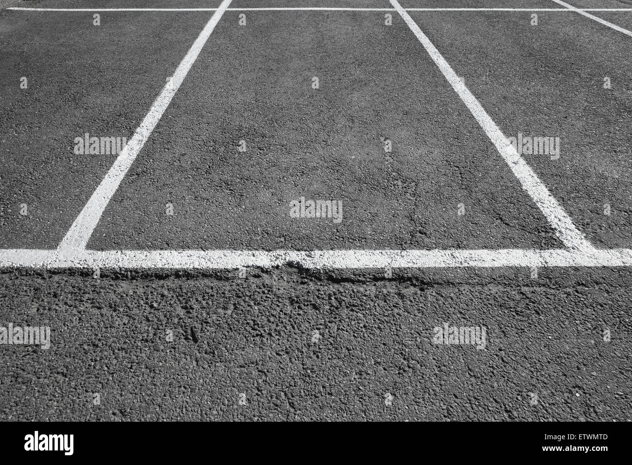 Empty place on urban parking lot, white marking lines over gray asphalt ...