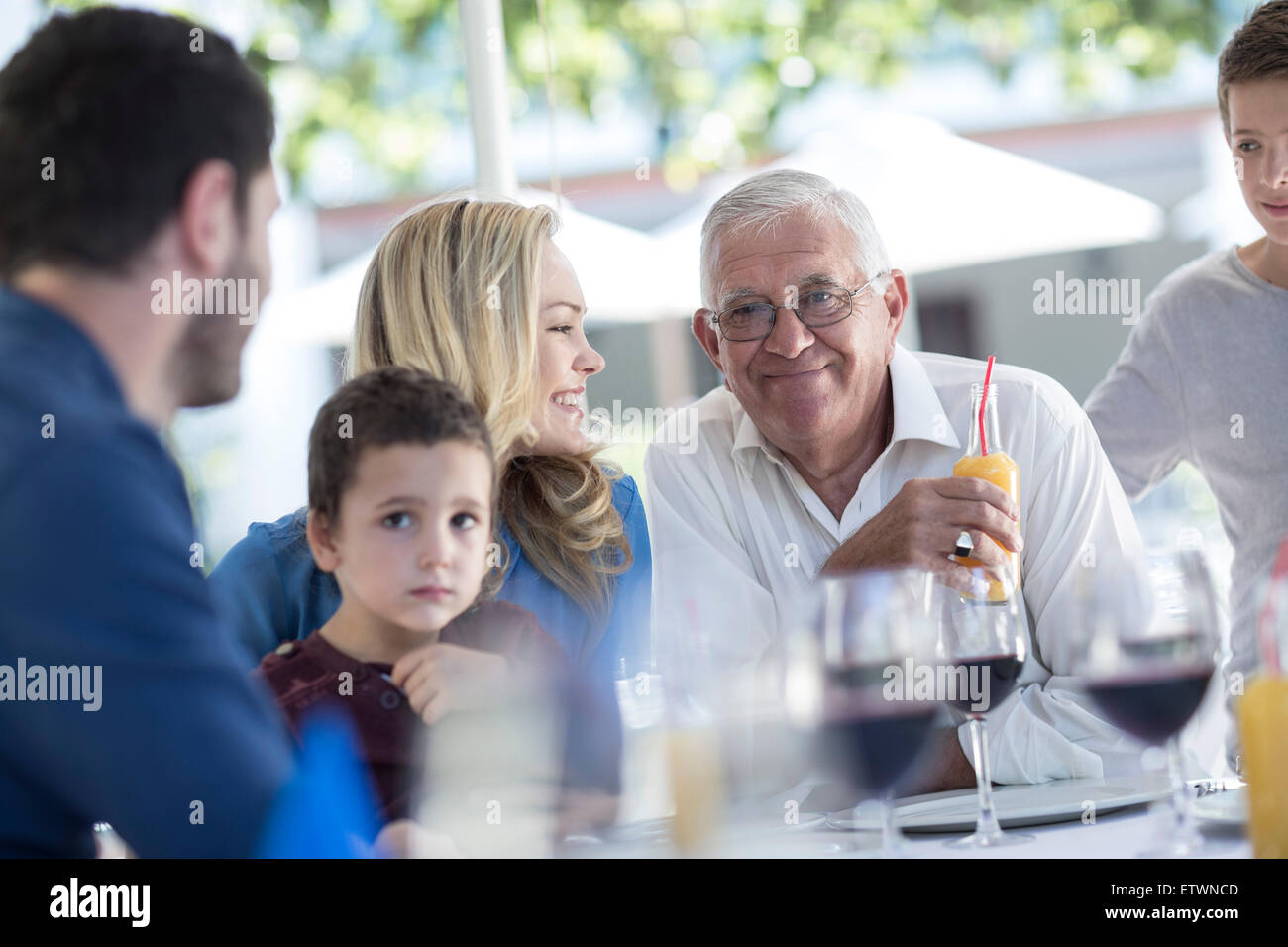 Extended family in restaurant having a celebration Stock Photo - Alamy