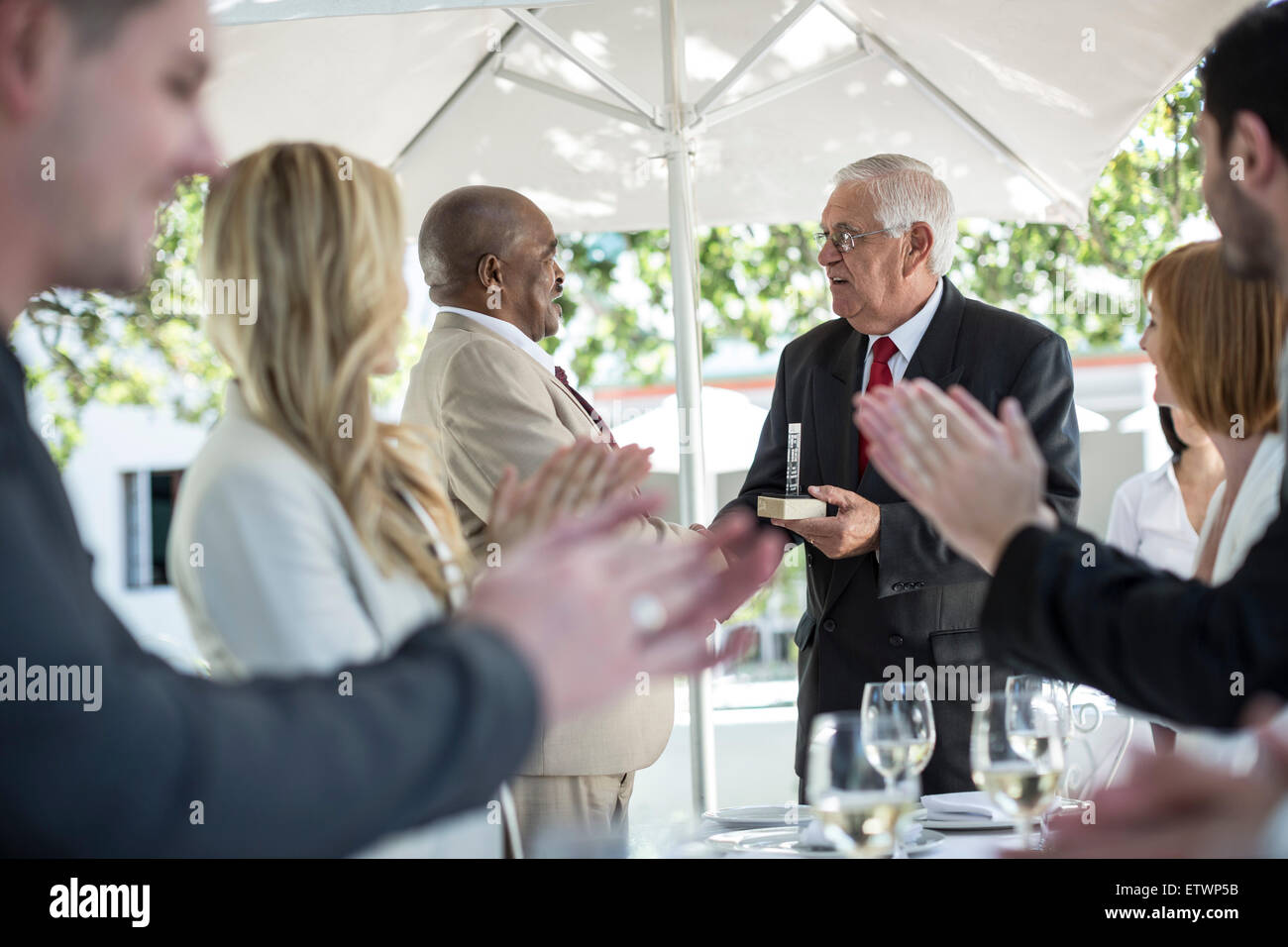 Businesspeople celebrating achievements in restaurant Stock Photo - Alamy