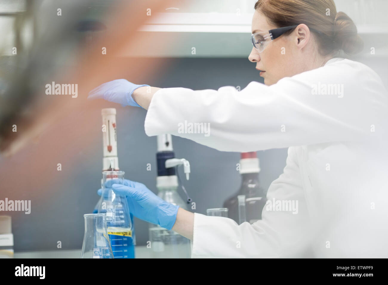 Scientist in glasses filling hi-res stock photography and images - Alamy