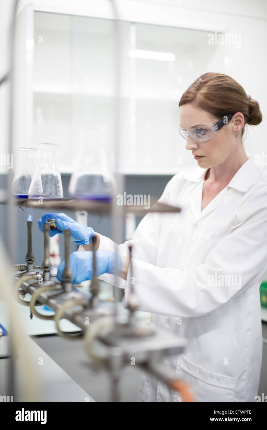 Scientist in lab working with liquids Stock Photo - Alamy