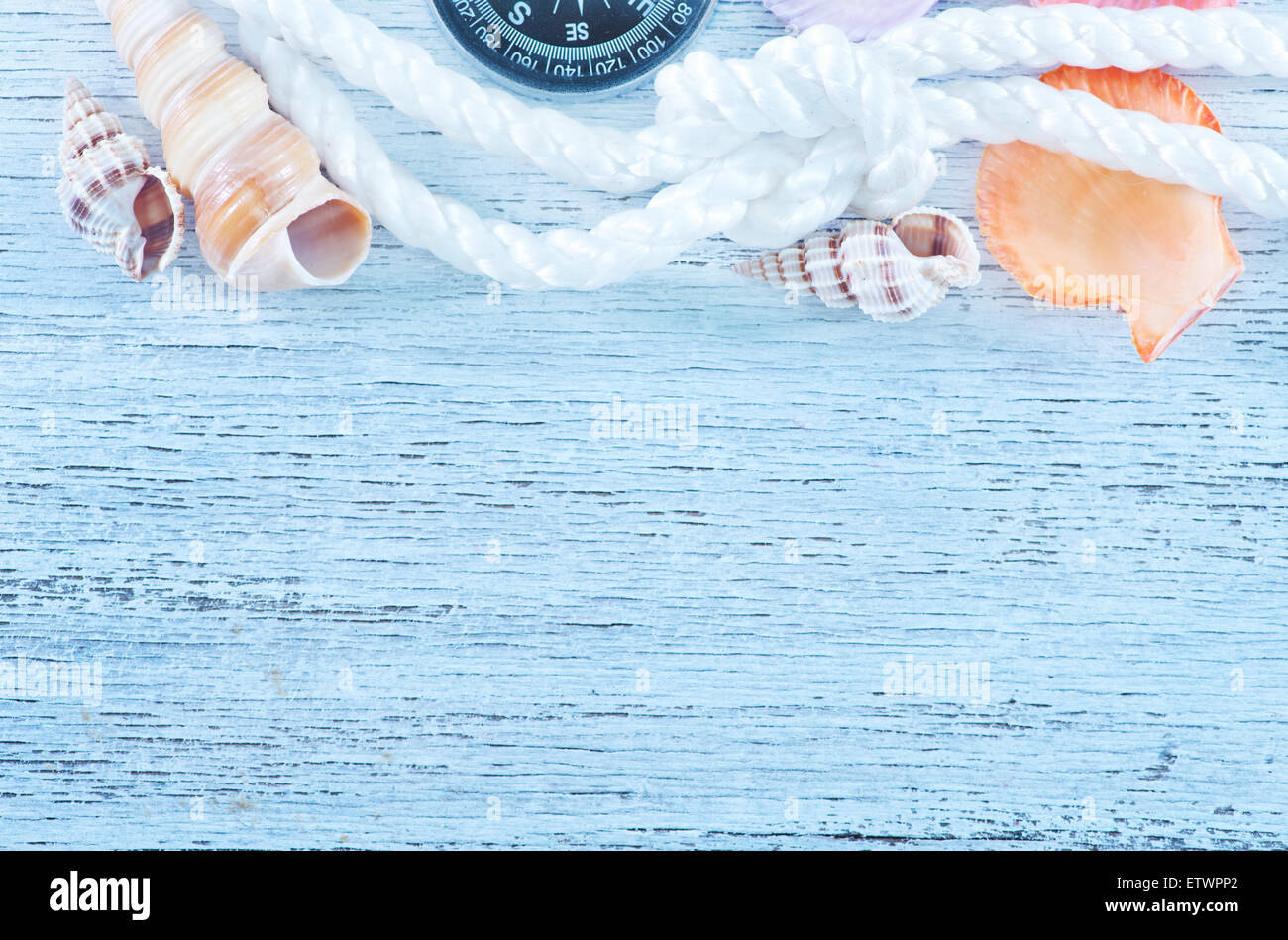 rope,sea shell and compass on a table Stock Photo - Alamy