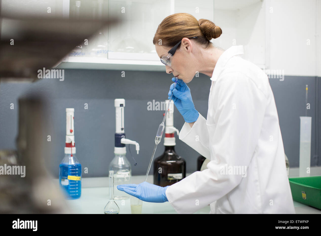 Scientist pipetting liquid in test hi-res stock photography and images ...