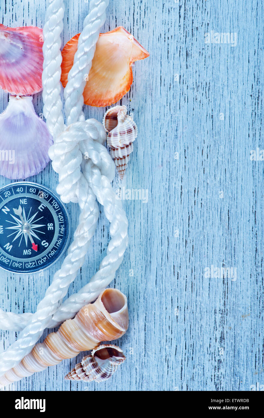 rope,sea shell and compass on a table Stock Photo - Alamy