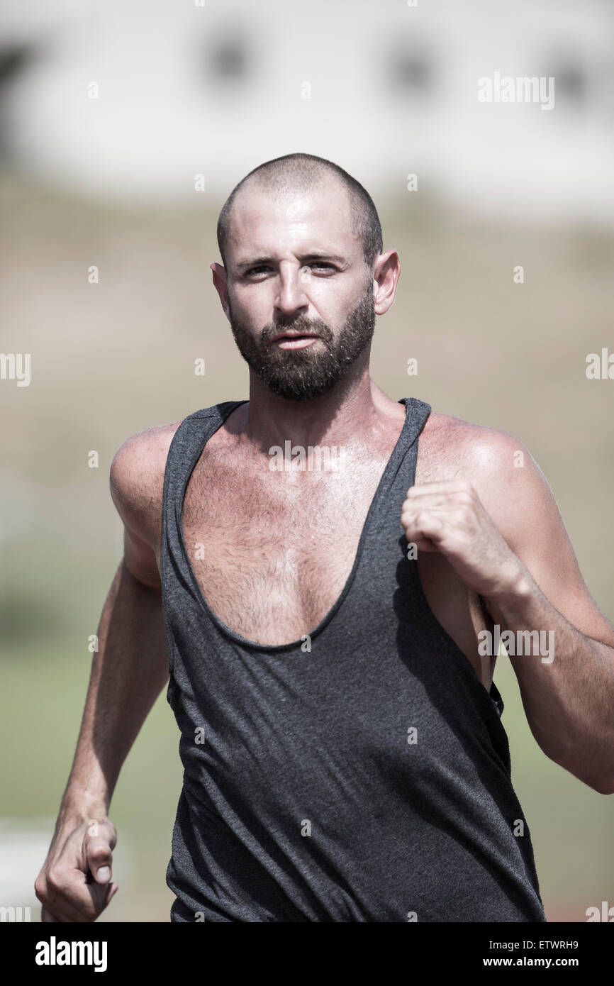 Portrait of running sportsman Stock Photo - Alamy