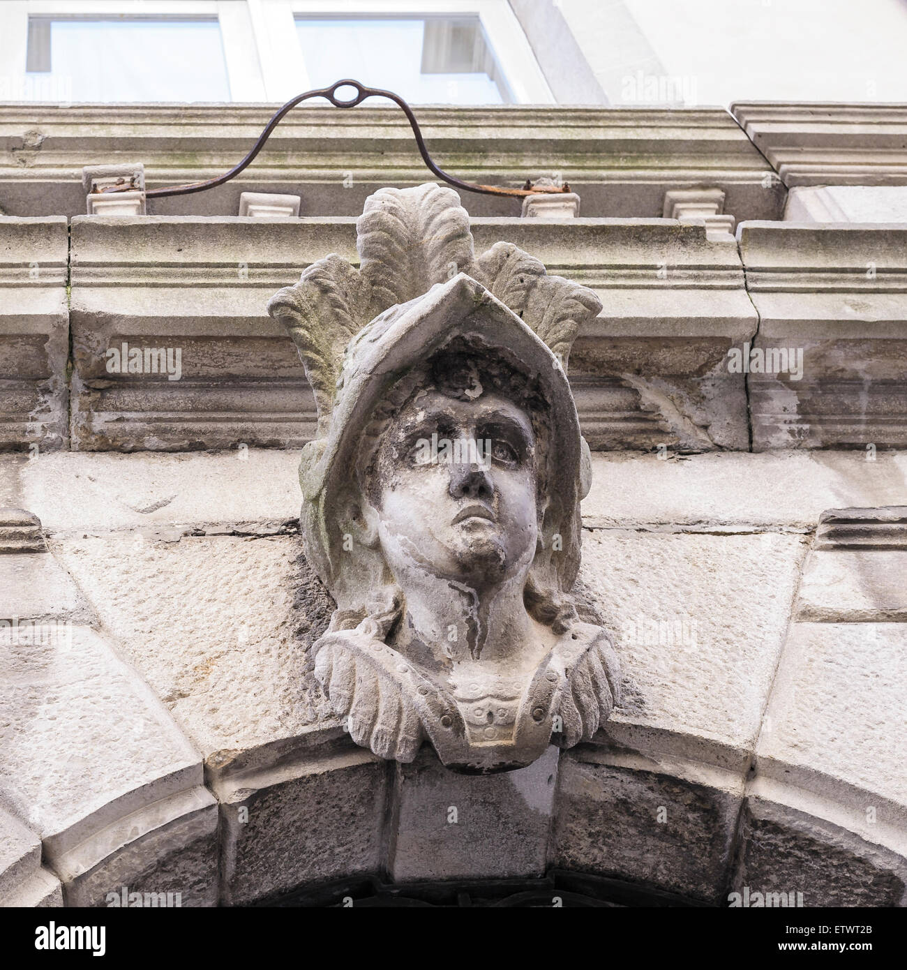 Stone head on a stone arch, the old Italian tradition to protect the ...