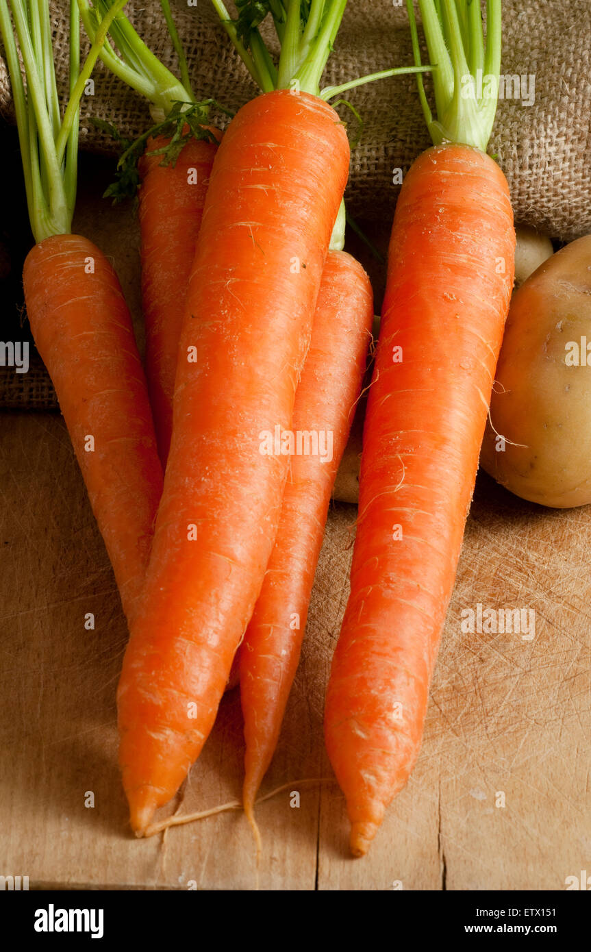 carrots that are out of the jute bag ready to be cleaned Stock Photo ...