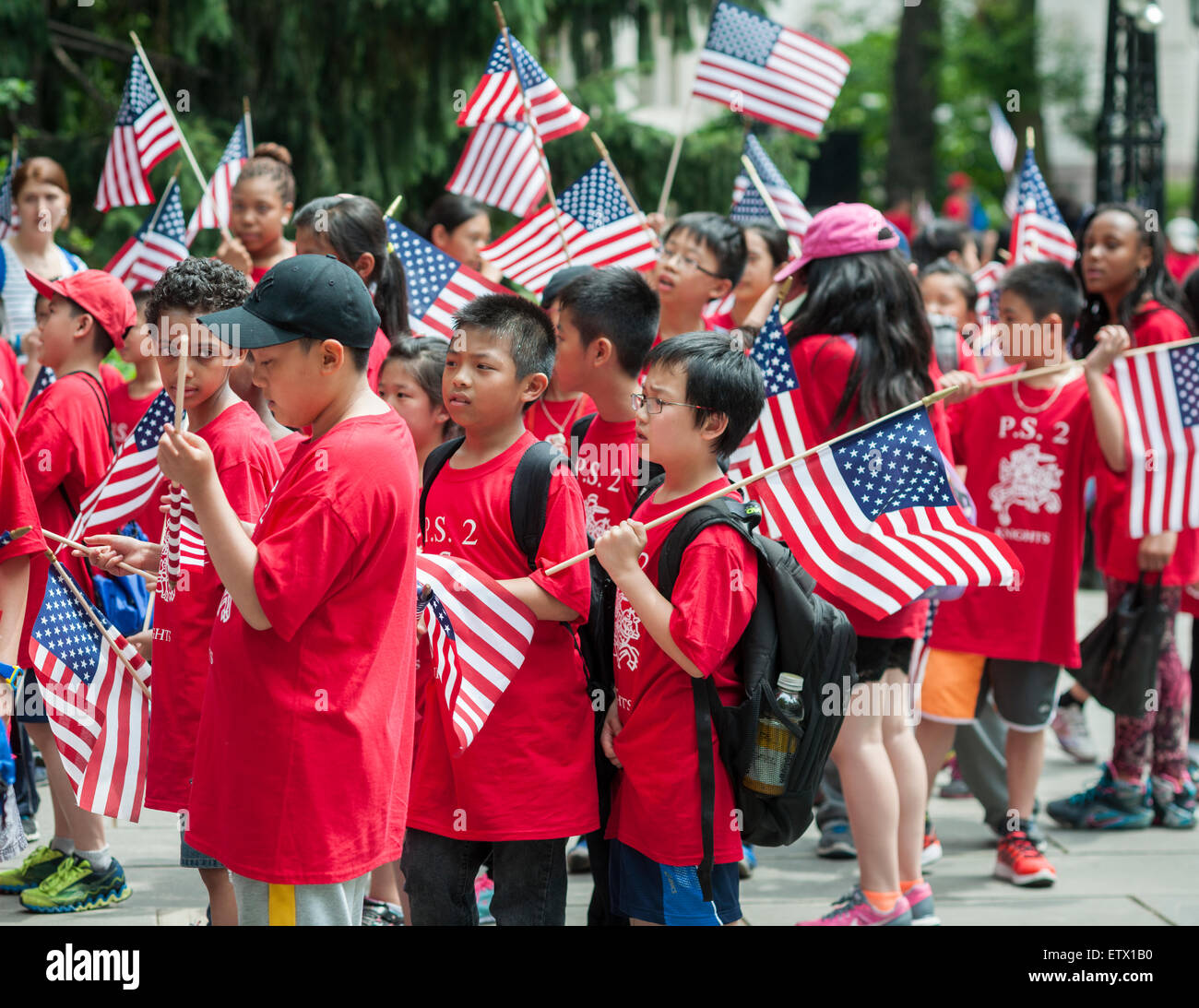 Students from P.S. 2 in Chinatown in New York march in the annual Flag ...
